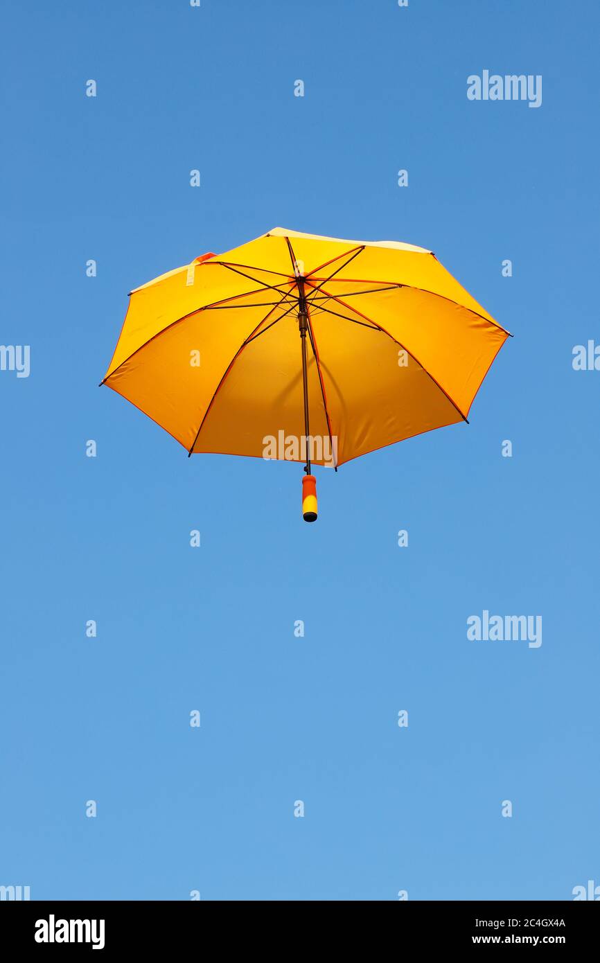 Blue and yellow umbrella hi-res stock photography and images - Alamy