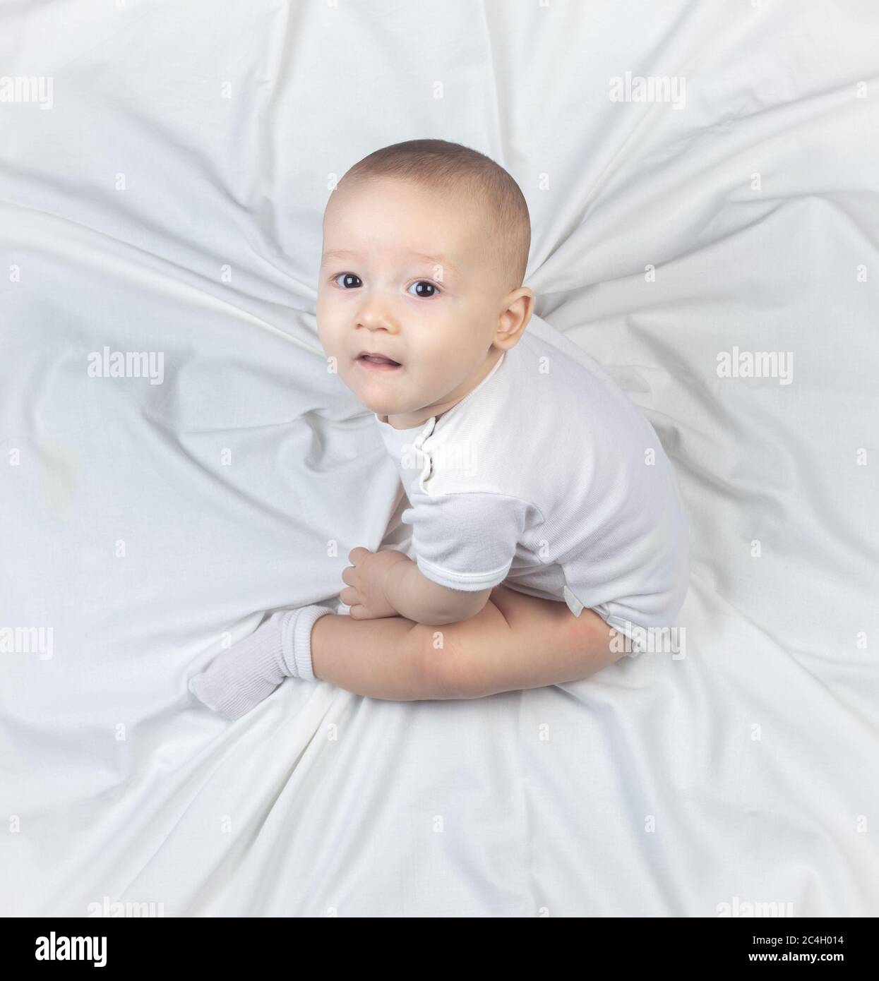 Photo of sitting seven month old baby, top view Stock Photo - Alamy