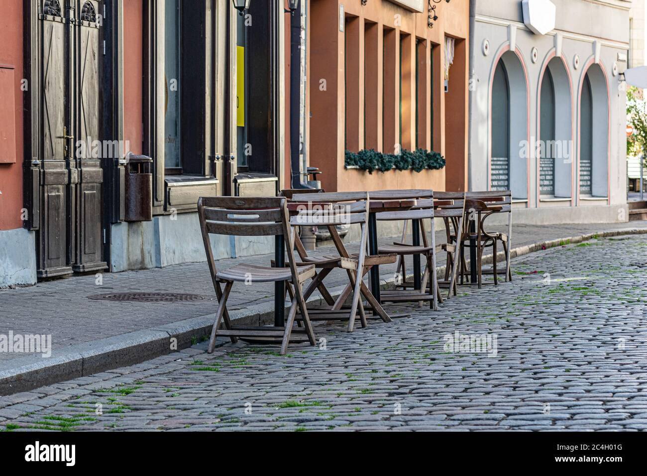 Outdoor cafe with chairs, outdoor restaurant. Ancient architecture ...