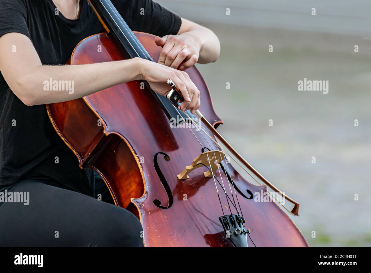 Woman playing a double bass during a performance or music recital ...