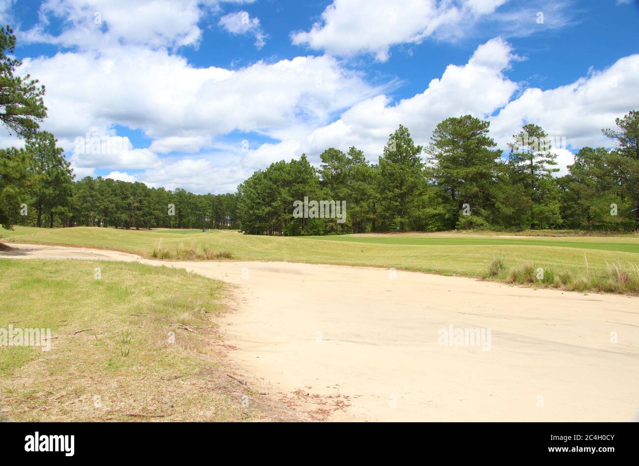 Dirt path on a golf course with blue sky background Stock Photo - Alamy