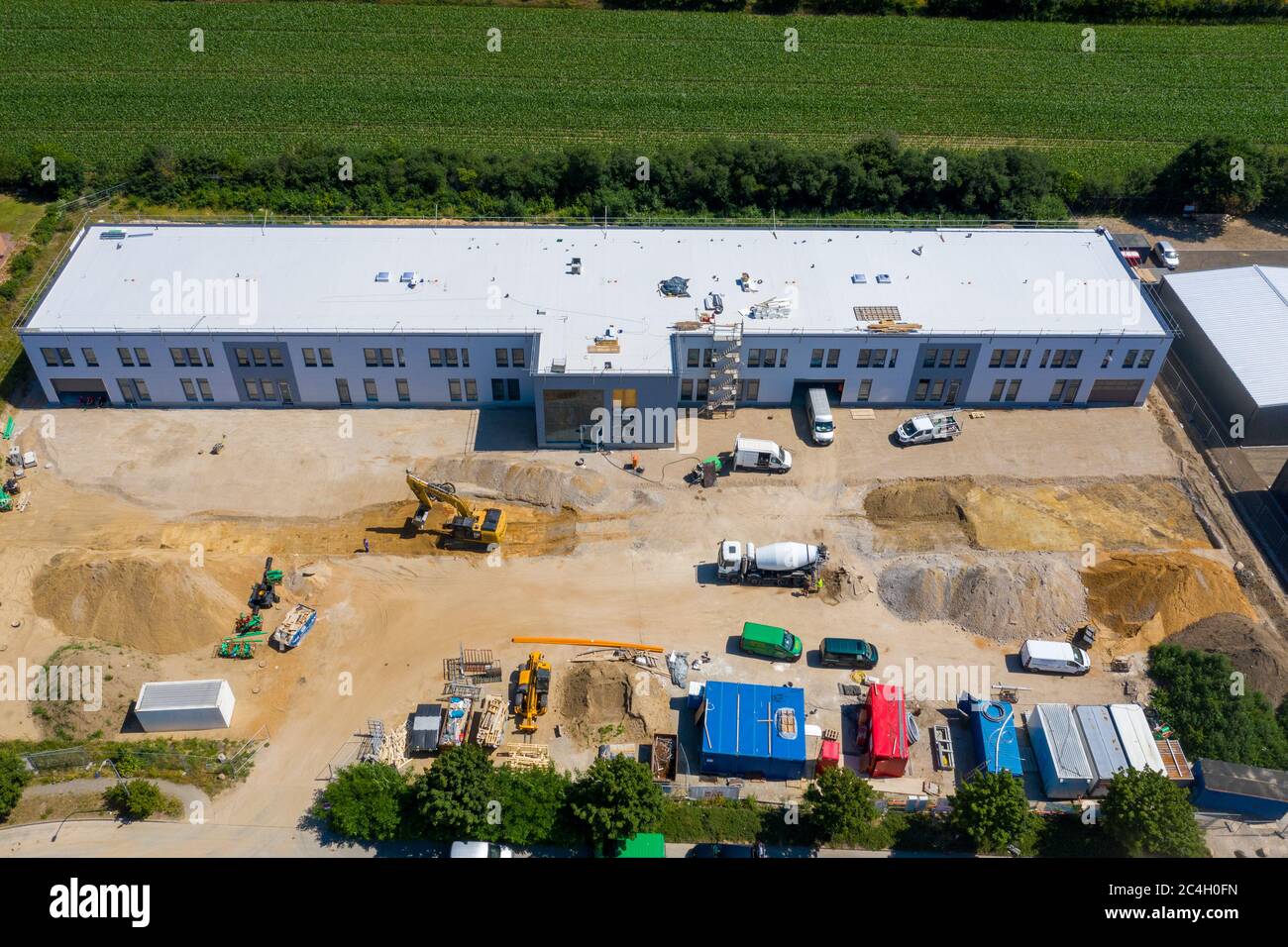 a drone photograph of a large construction site where a factory ...