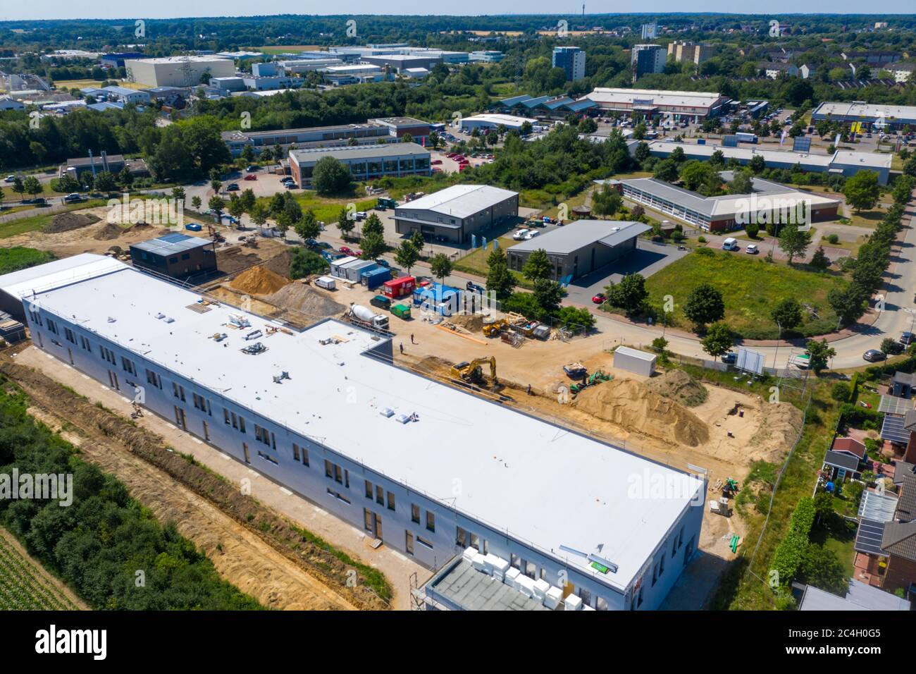 a drone photograph of a large construction site where a factory ...