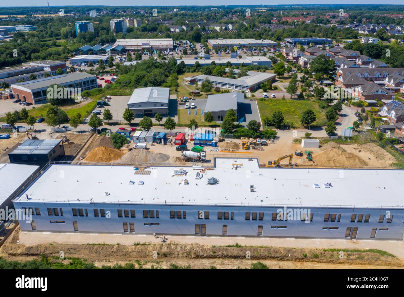 a drone photograph of a large construction site where a factory ...