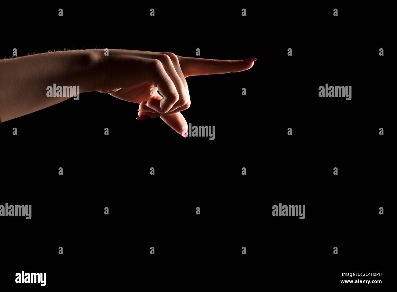 Womans hand on dark hi-res stock photography and images - Alamy