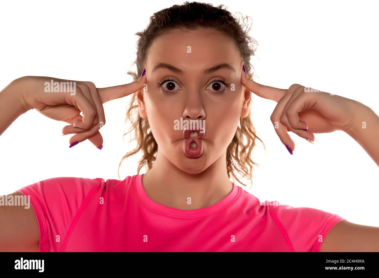funny young woman making fish face on white background Stock Photo - Alamy