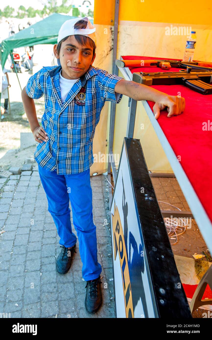 A gypsy boy at a shooting gallery set up during the Kirkpinar Turkish ...