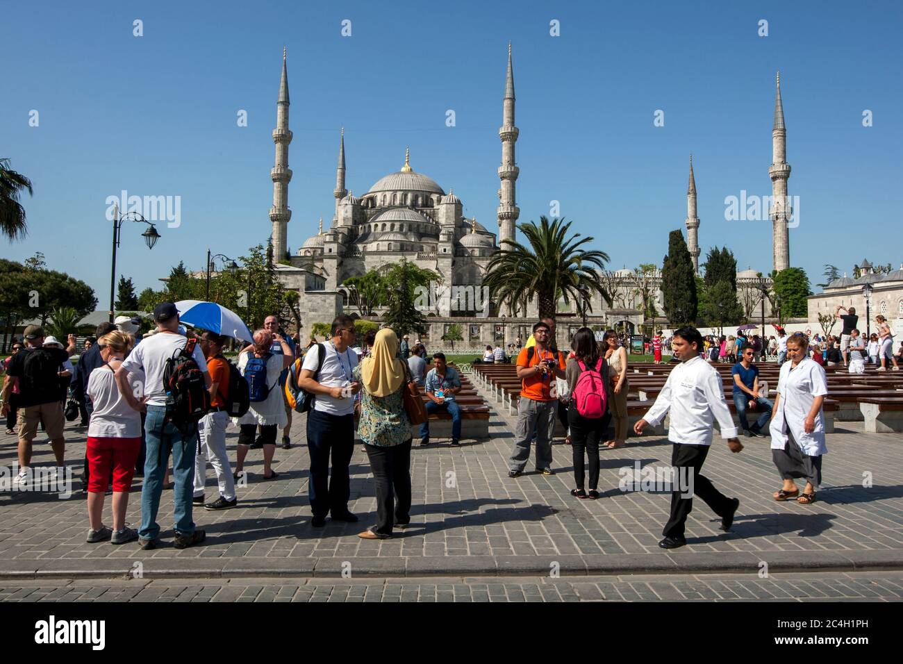Tourists gather in Sultanahment Park in the Sultanahmet district of ...