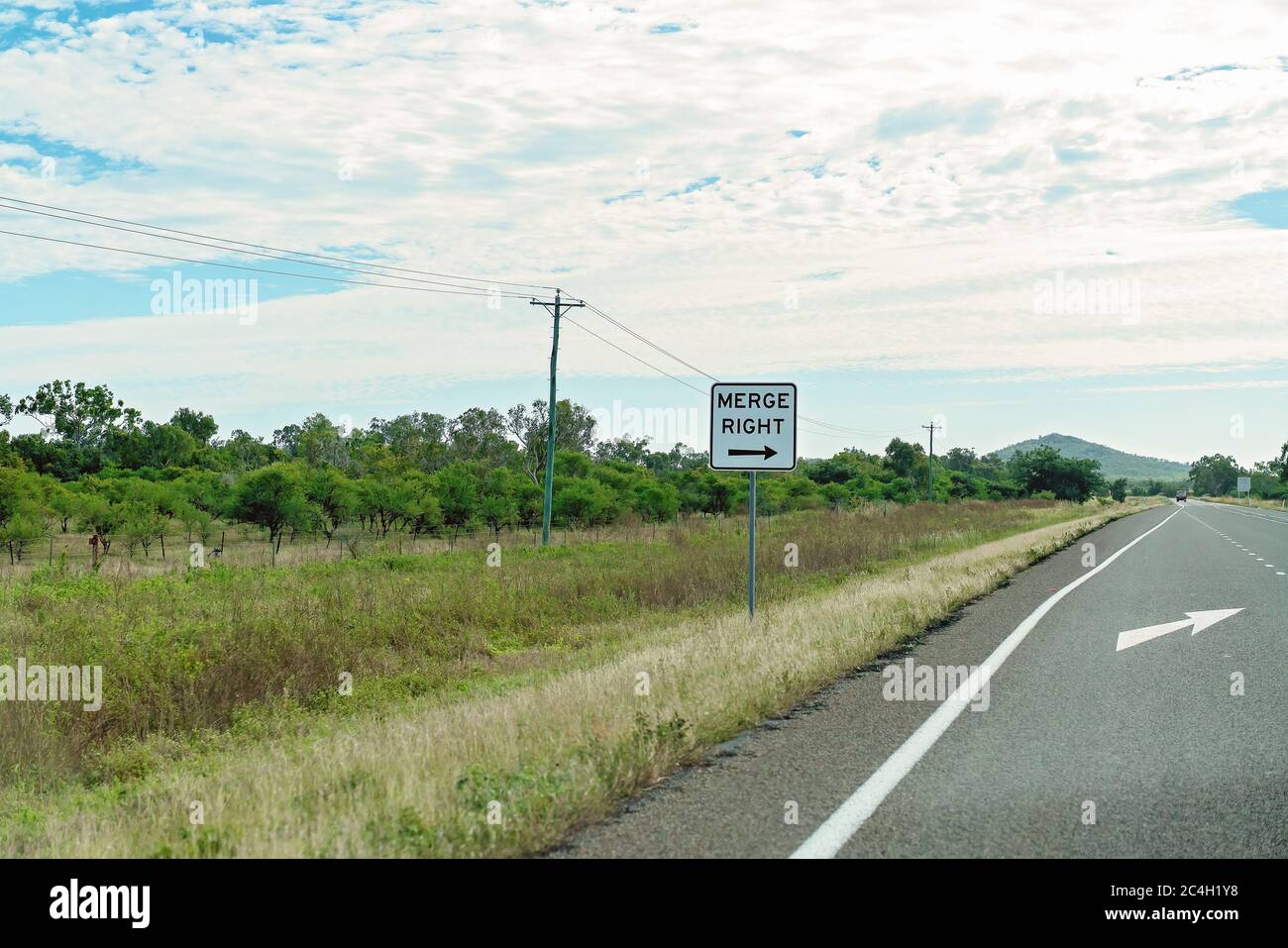 Merge Right highway sign instructing traffic Stock Photo - Alamy