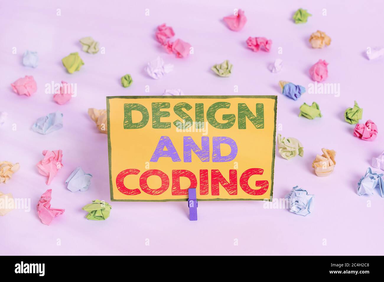 Writing note showing Design And Coding. Business concept for HTML and programming, Cross ...