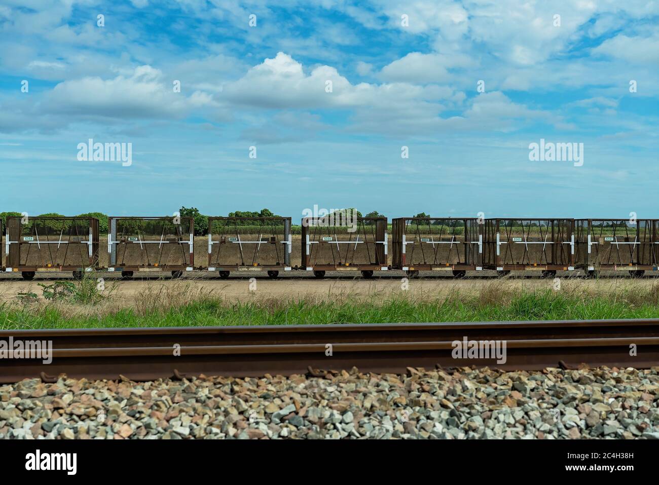 Empty sugar cane bins at a railway siding in the country ready to be ...