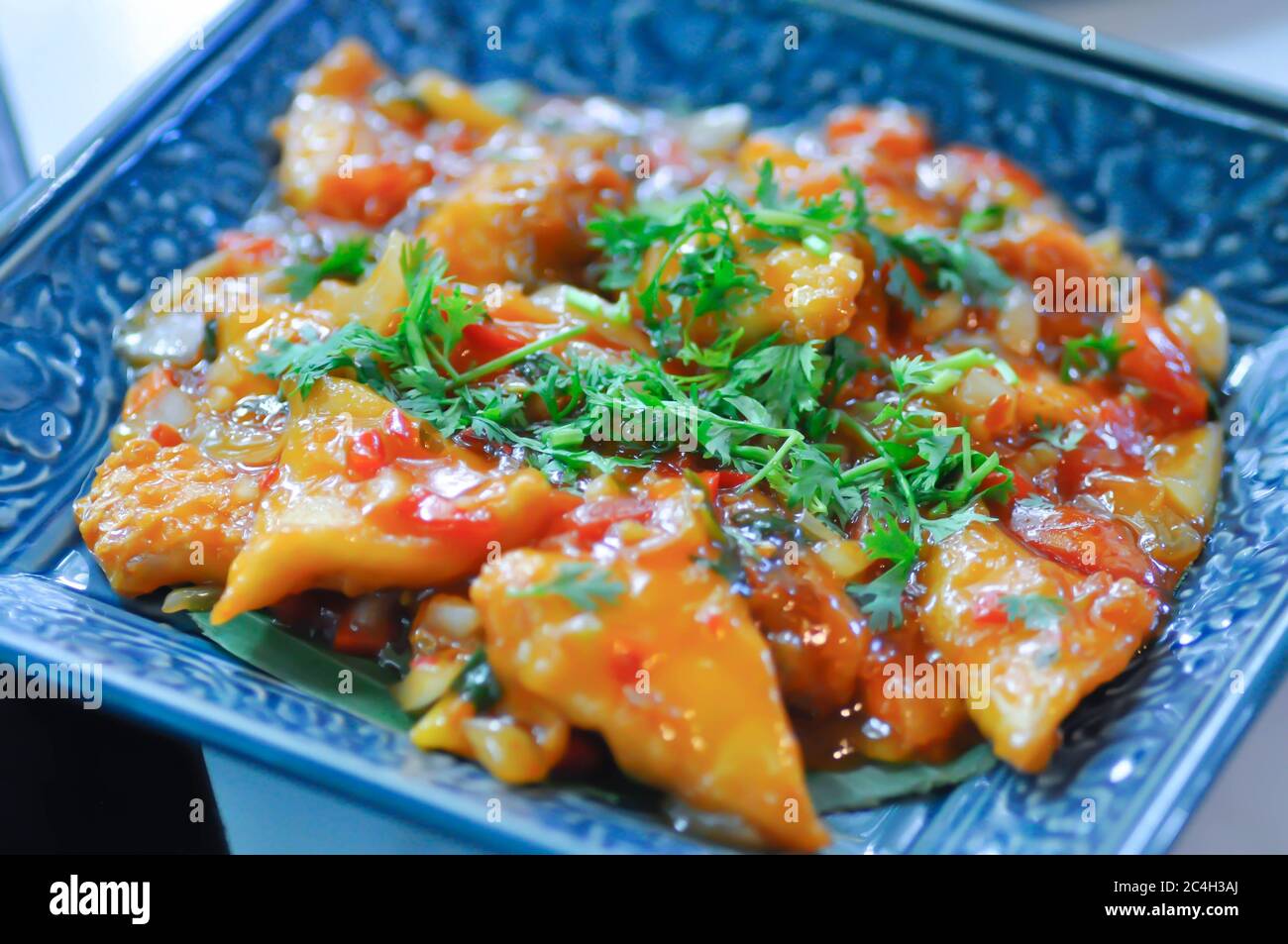 fried fish or stir fried fish ,stir fried Sea bass fish Stock Photo - Alamy