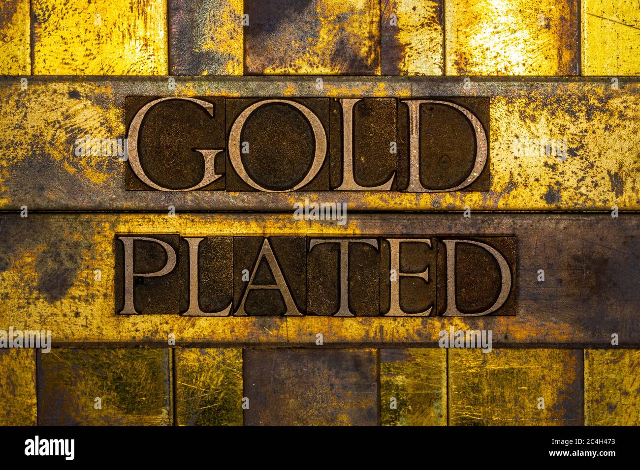 Gold Plated text formed with real authentic typeset letters on vintage ...