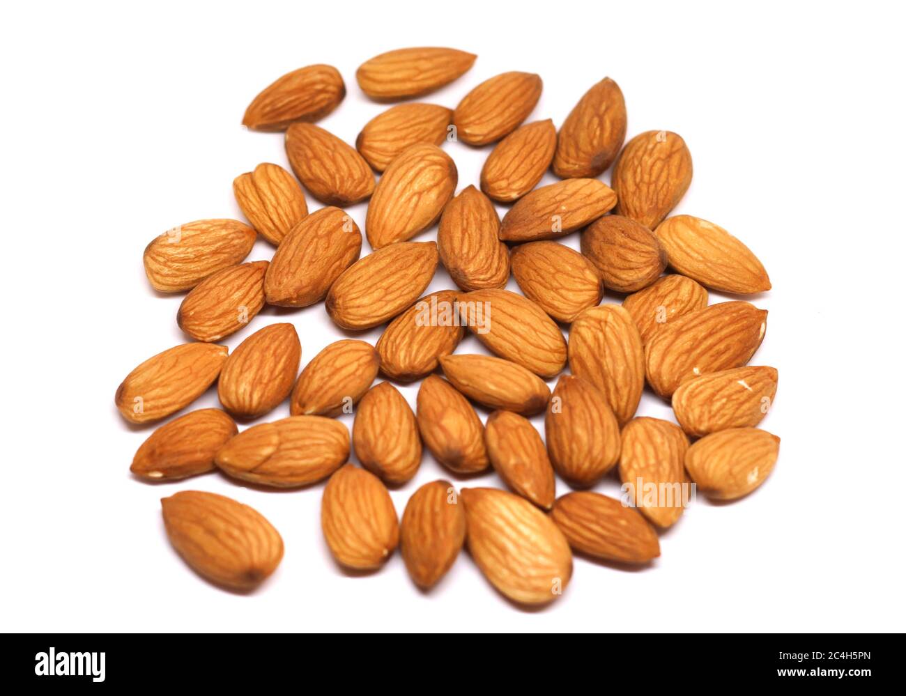 Almonds close up shot in white background Stock Photo - Alamy