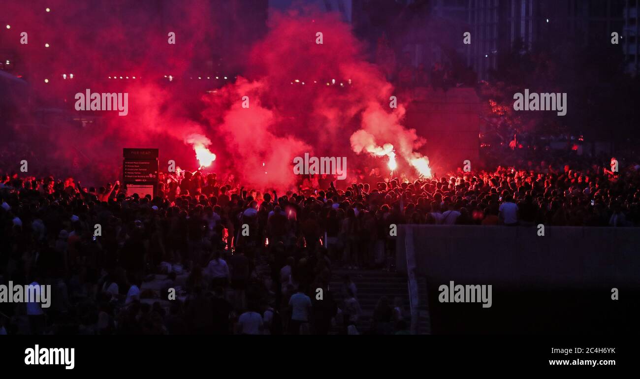 Liverpool fans let off flares outside the Liver Building in Liverpool ...