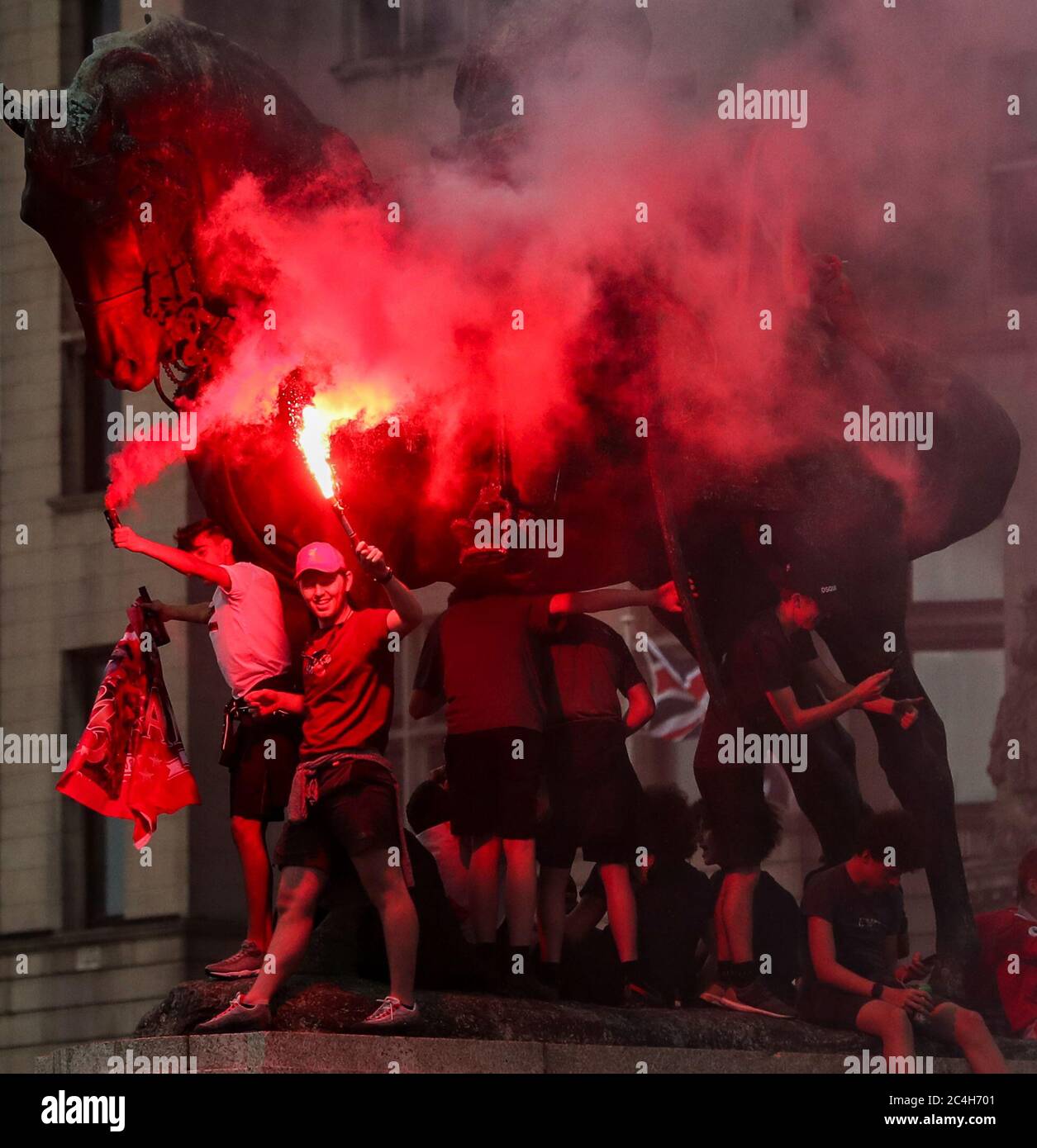 Liverpool fans let off flares outside the Liver Building in Liverpool ...
