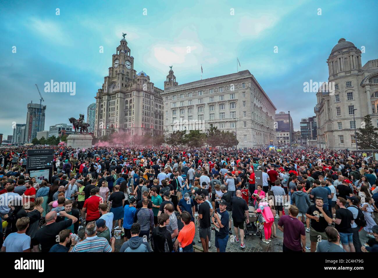 Liverpool fans let off flares outside the Liver Building in Liverpool ...