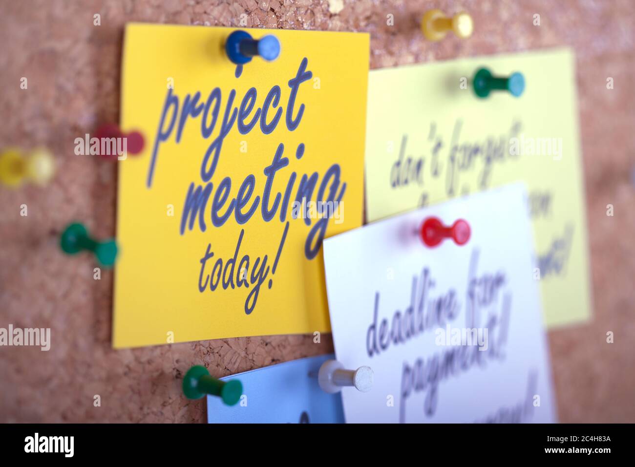 Reminders on board. Corkboard with caution messages Stock Photo - Alamy