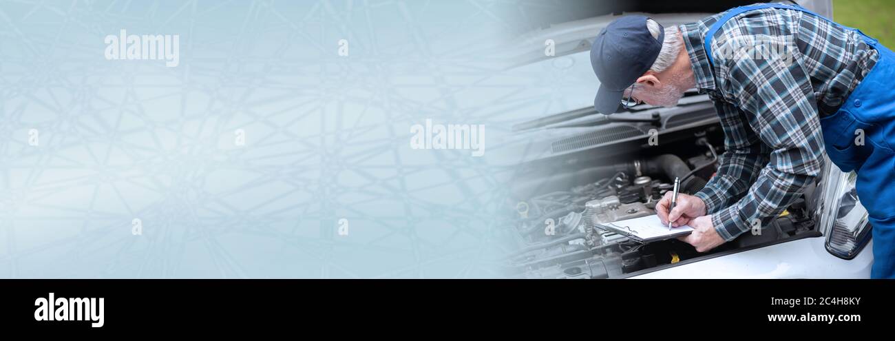 Car mechanic checking a car engine and writing on clipboard; panoramic ...