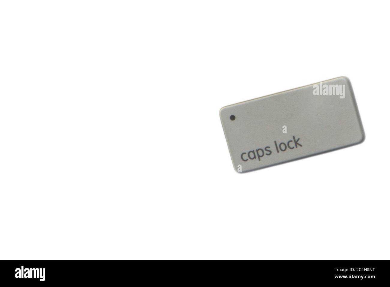 CAPS LOCK button computer keyboard on white background. Holiday and ...