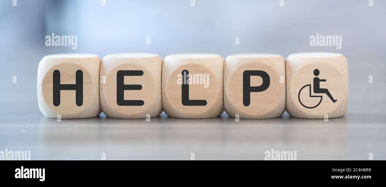 Concept of disability assistance on wooden cubes Stock Photo - Alamy