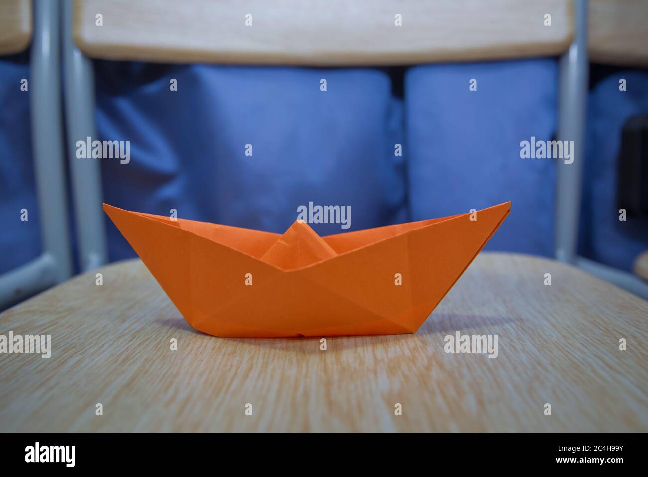 Leadership concept with blue paper ship leading among wooden . Blue ...
