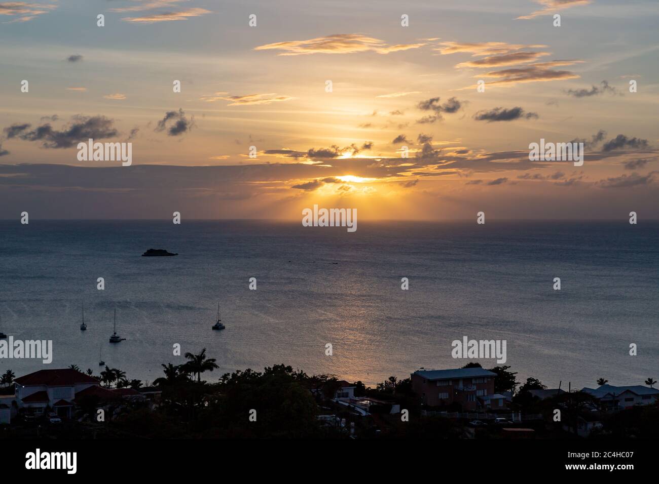 Sunset over the Caribbean Sea, from the island of Antigua Stock Photo ...