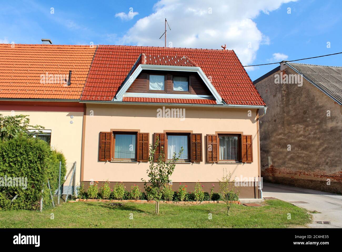 Attached completely renovated small suburban family house with new wooden frame windows and open ...