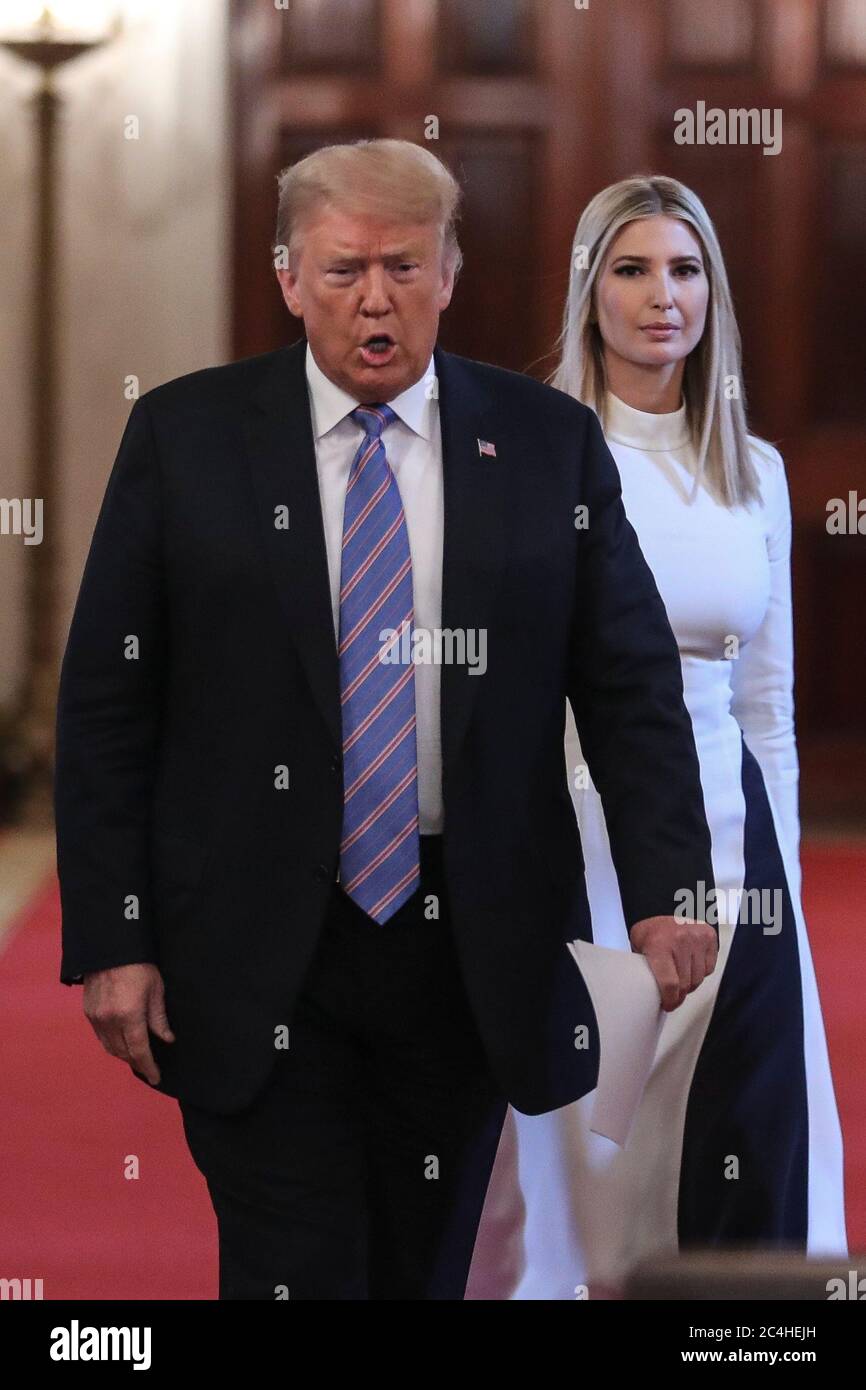 President Donald Trump arrives to the East Room of the White House with ...