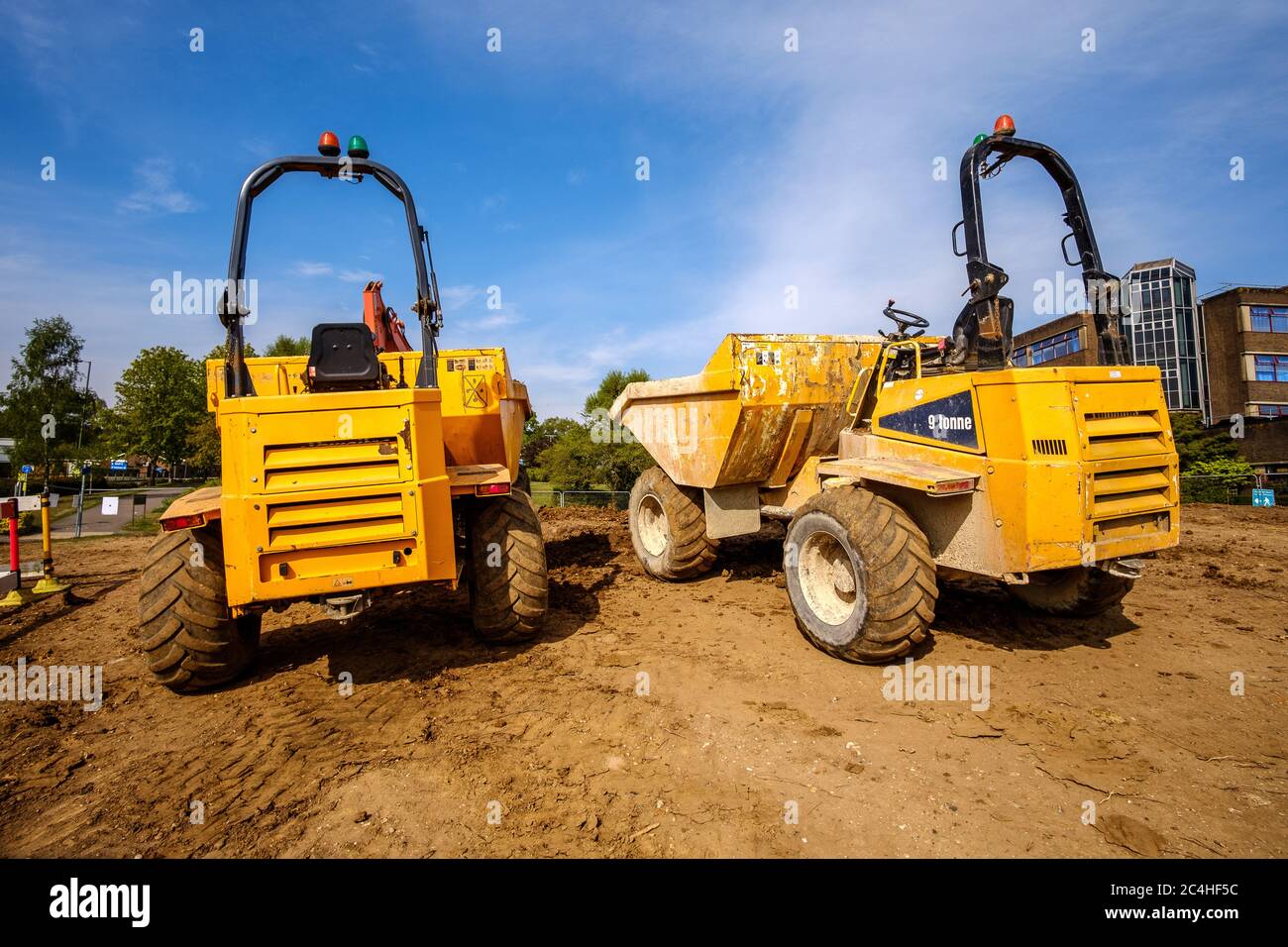 Yellow dump trucks / tipper trucks parked on construction site Stock ...