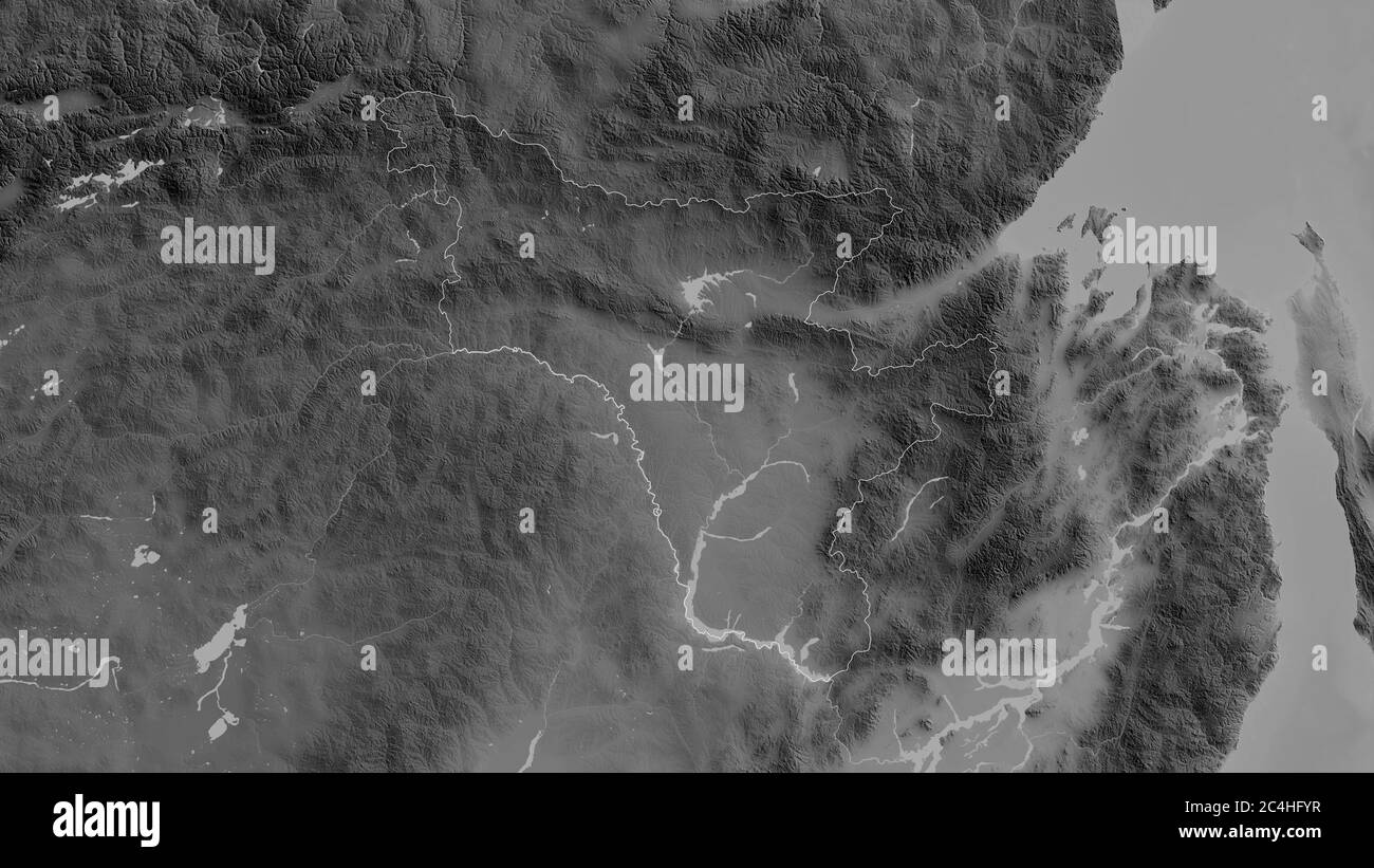 Amur, region of Russia. Grayscaled map with lakes and rivers. Shape outlined against its country ...