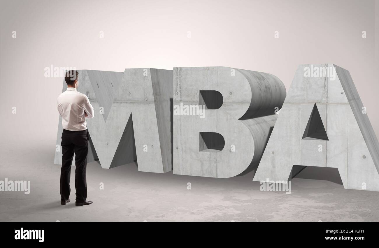 Rear view of a businessman standing in front of MBA abbreviation ...