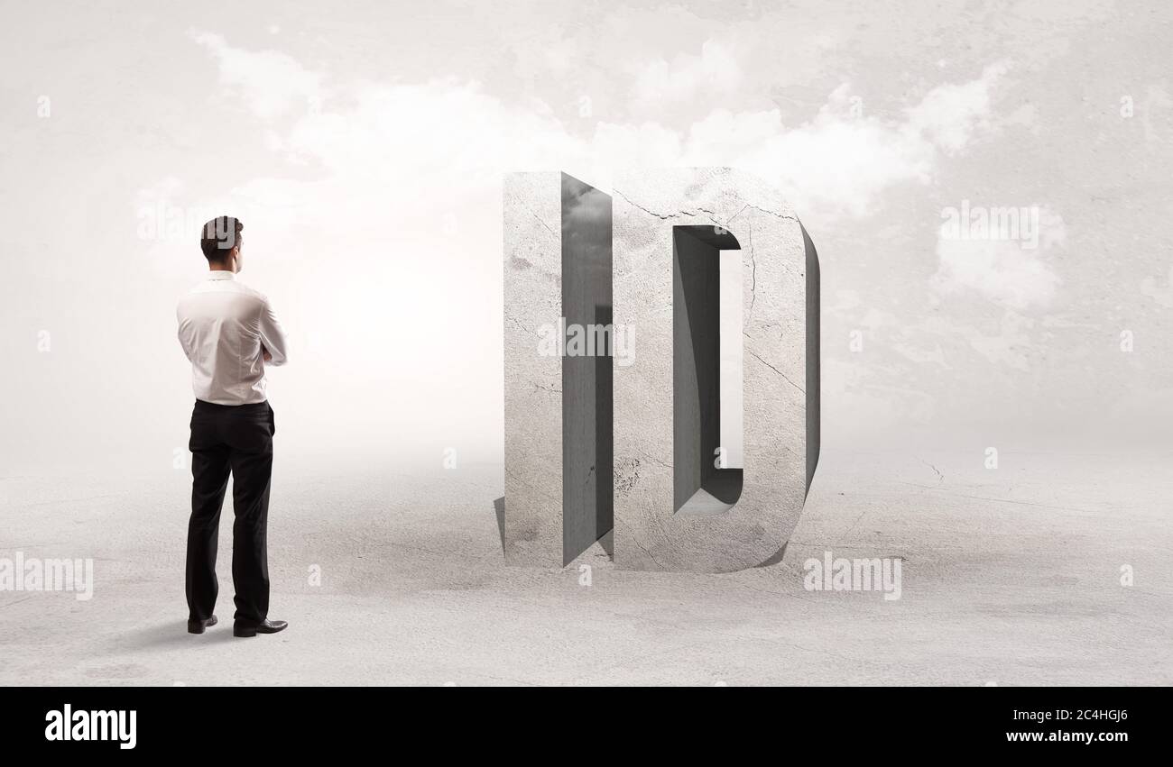 Rear view of a businessman standing in front of ID abbreviation ...