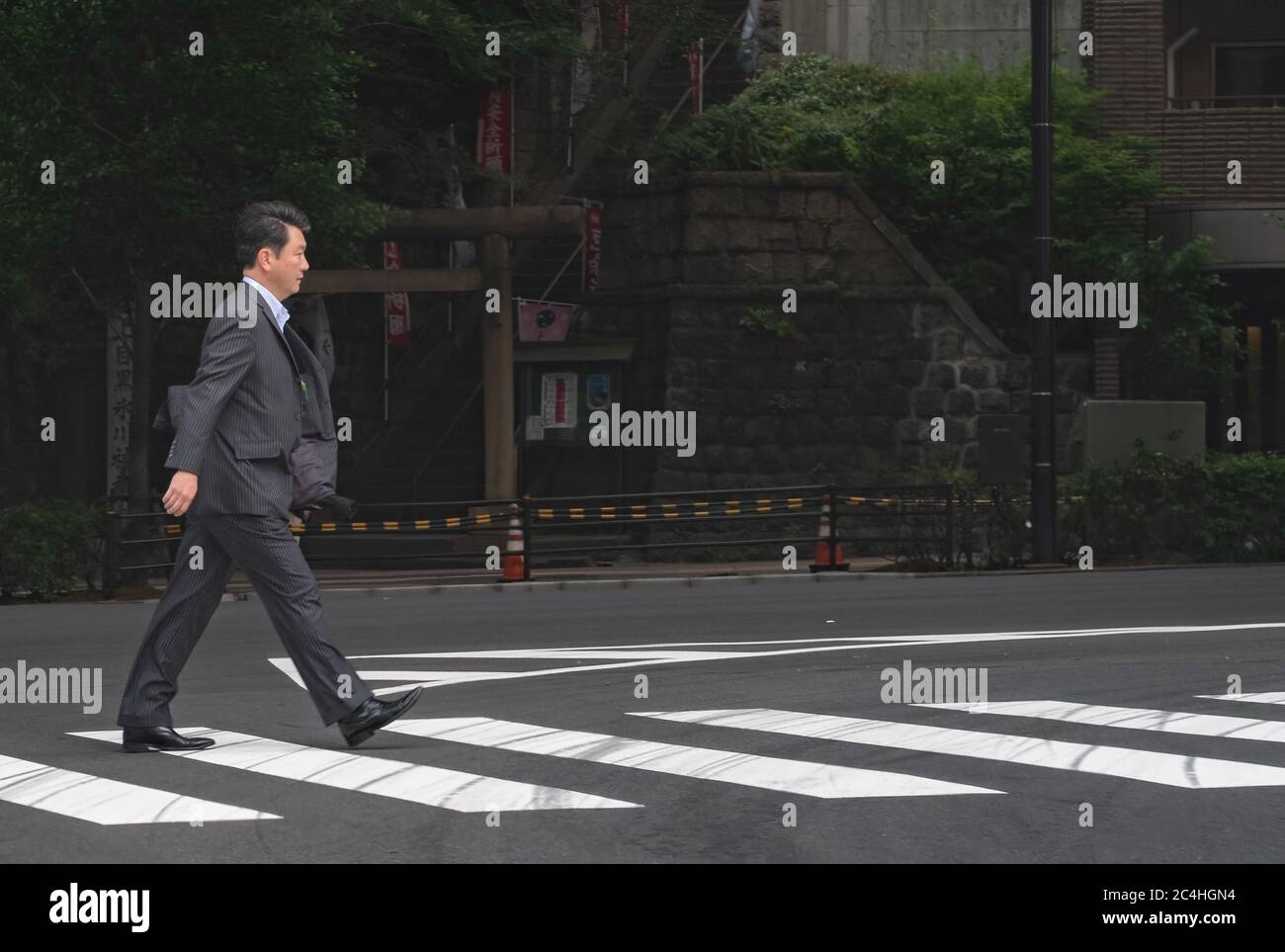 Man walking zebra crossing in hi-res stock photography and images - Alamy