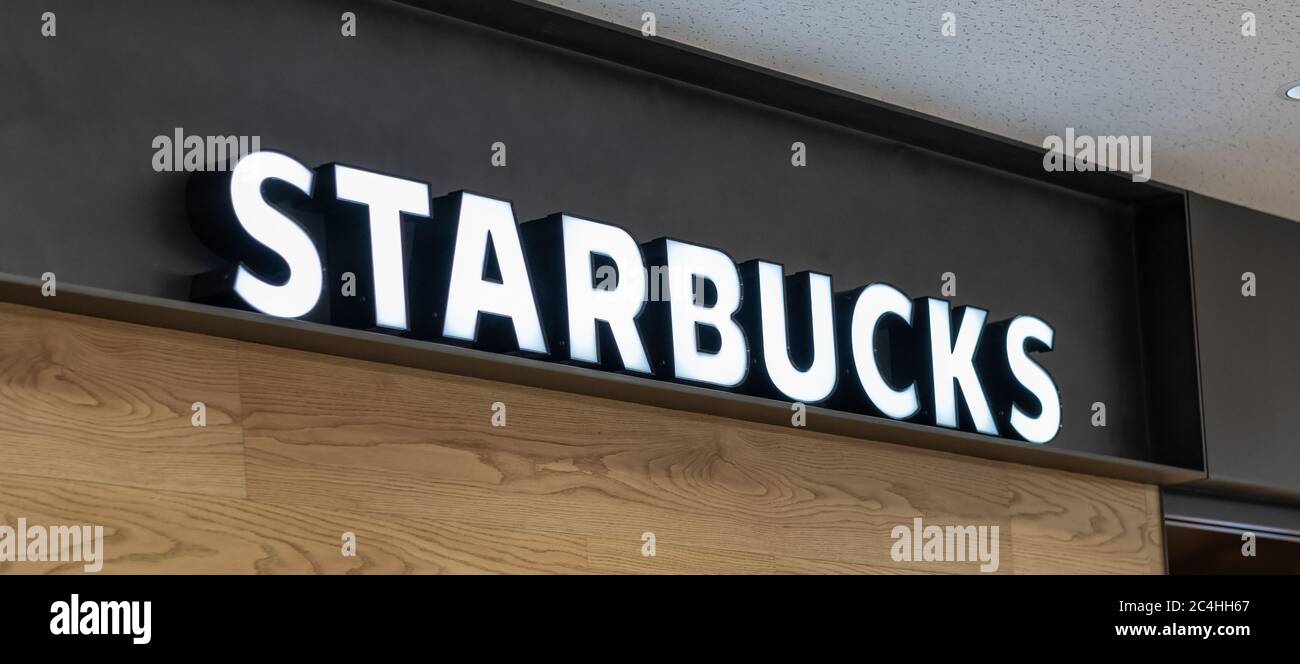 Starbucks coffeehouse sign Stock Photo - Alamy