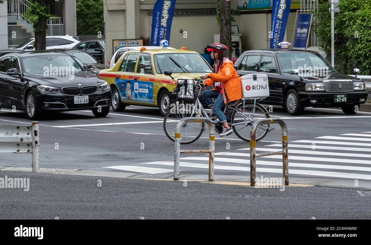 Bicycle delivery service in Tokyo street, Japan Stock Photo - Alamy