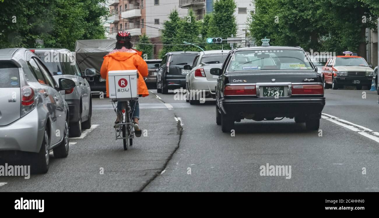 Bicycle delivery service in Tokyo street, Japan Stock Photo - Alamy