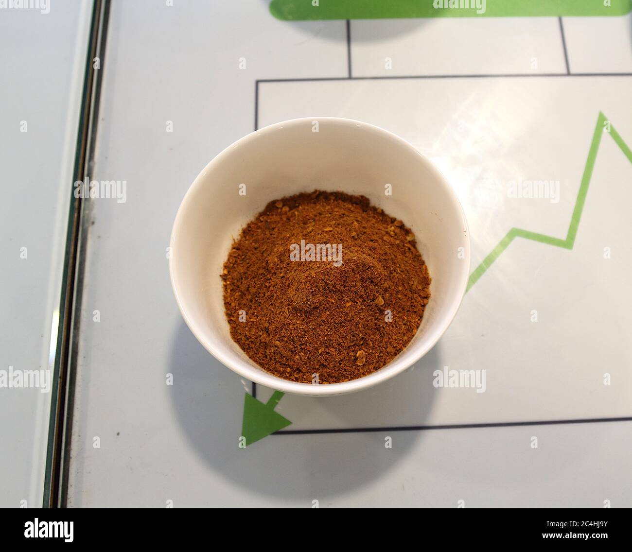 Spice mix powder spicy and sour in a small bowl Stock Photo - Alamy