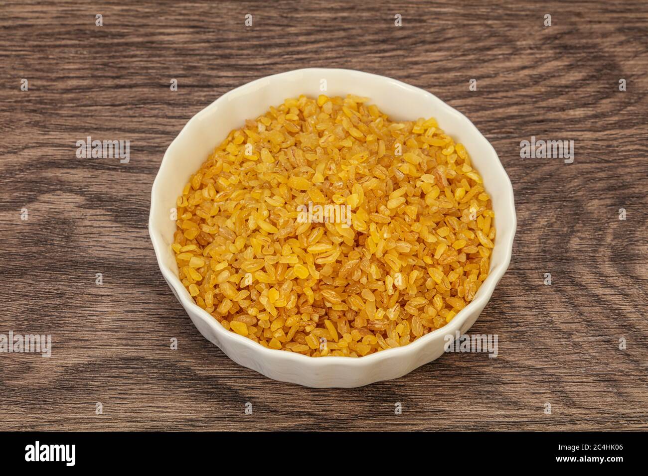 Vegetarian cuisine - dry bulgur for cooking in the bowl Stock Photo - Alamy