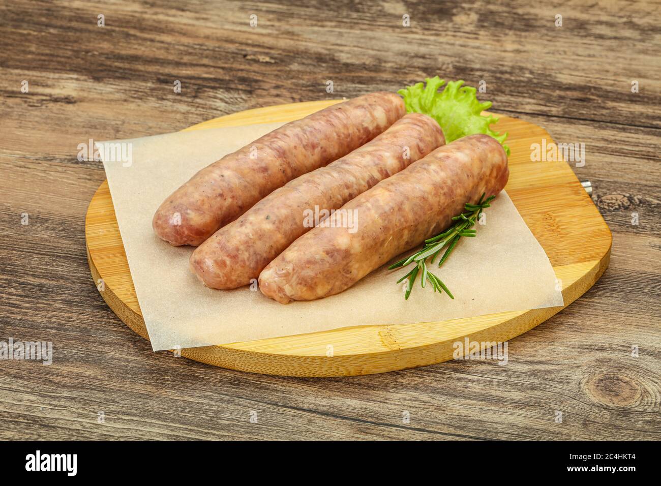Raw pork meat sausages for grill served rosemary Stock Photo - Alamy