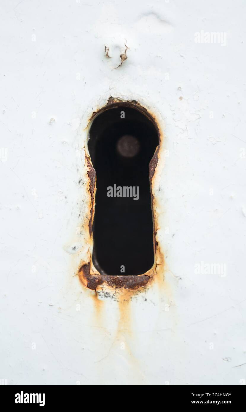 Old, rusty keyhole white safe Stock Photo - Alamy