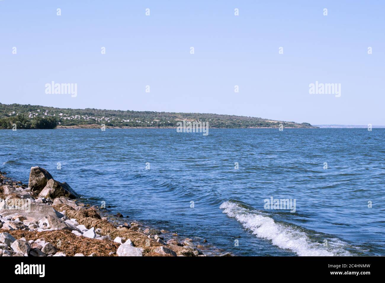 Sea wave on a granite beach in summer Stock Photo - Alamy