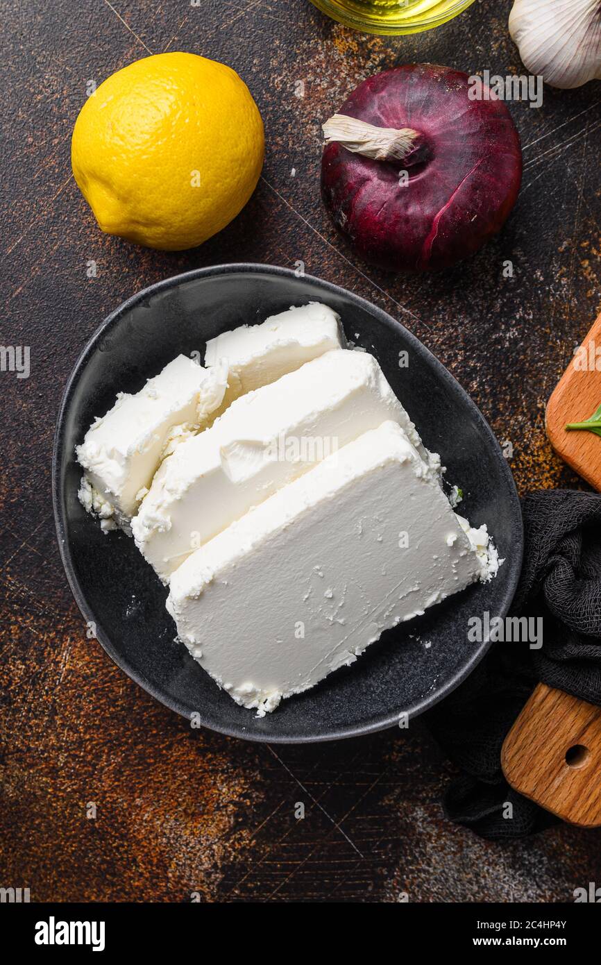 Traditional feta cheese in black bowl top view Stock Photo - Alamy
