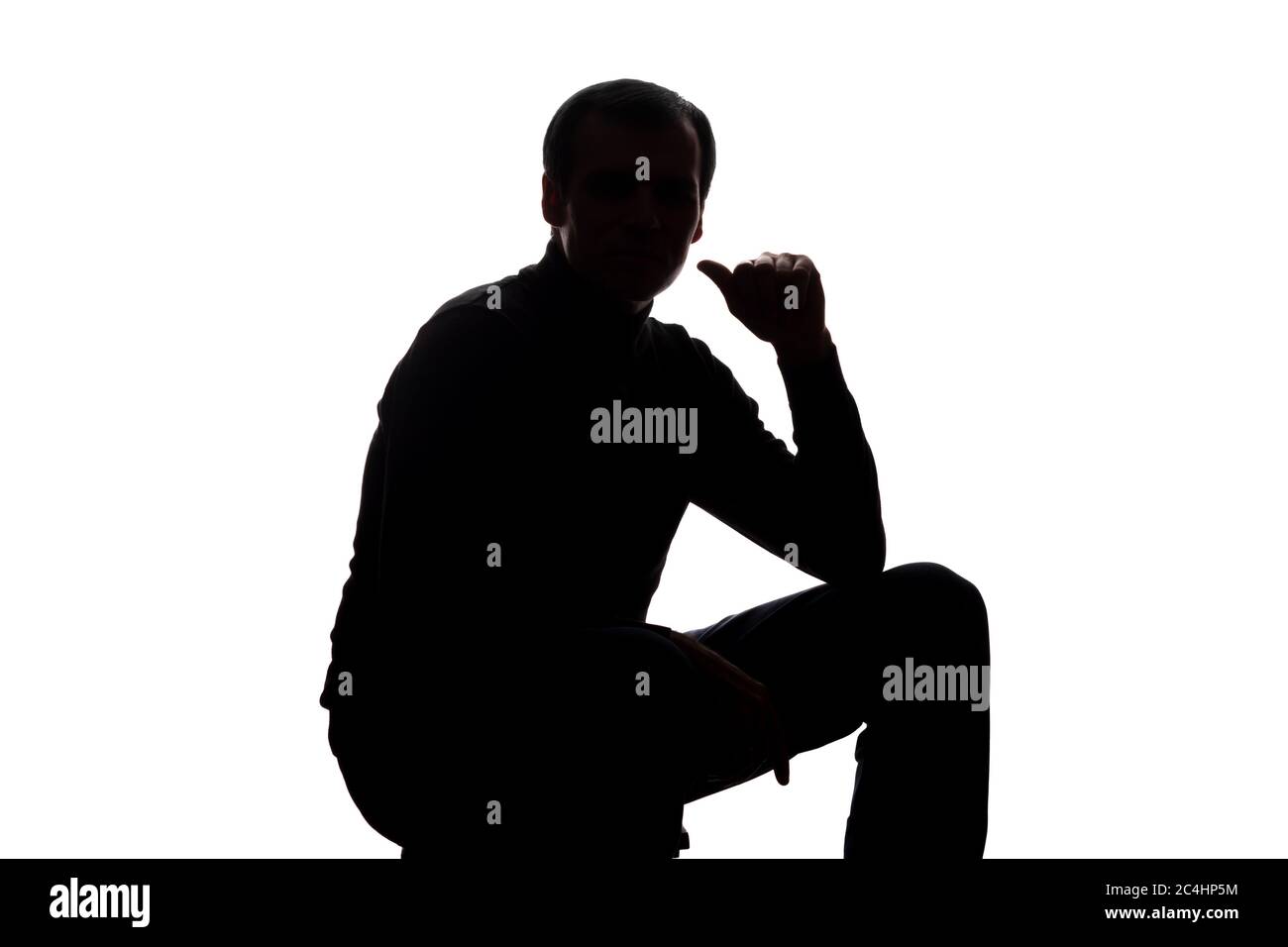 Young man with grief dropped his arms - silhouette Stock Photo - Alamy