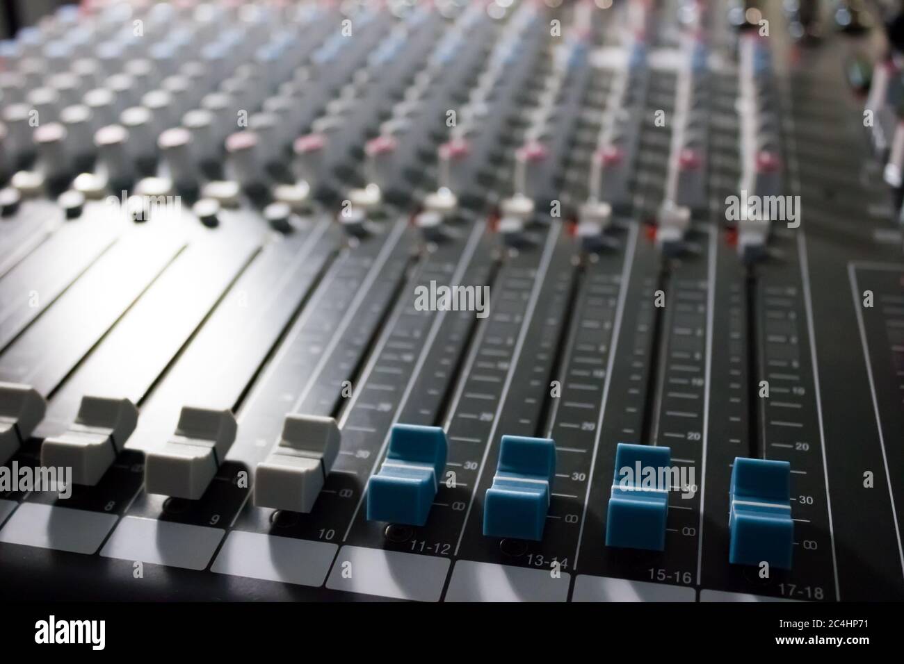 Console of a professional mixer with a lot of controls - music, concert ...