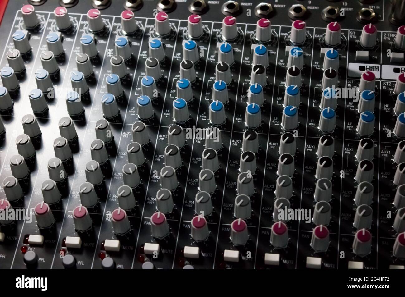 Console of a professional mixer with a lot of controls - music, concert ...