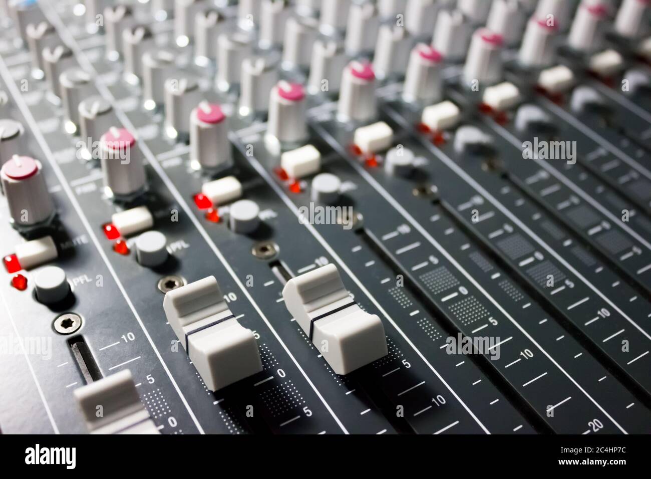 Console of a professional mixer with a lot of controls - music, concert ...
