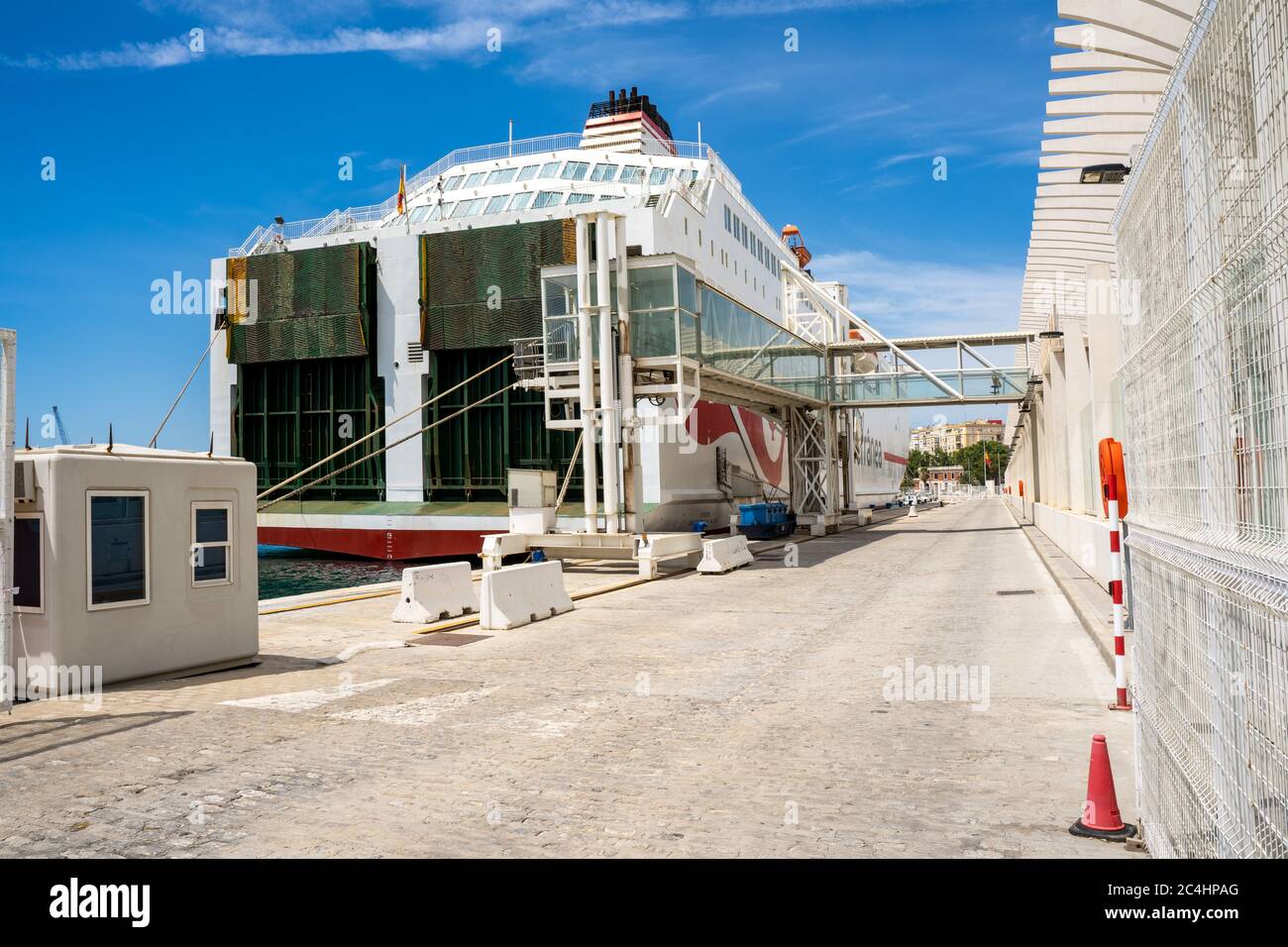 Big cruise ship at the dock with closed ramp seen from behind. Deck of ...
