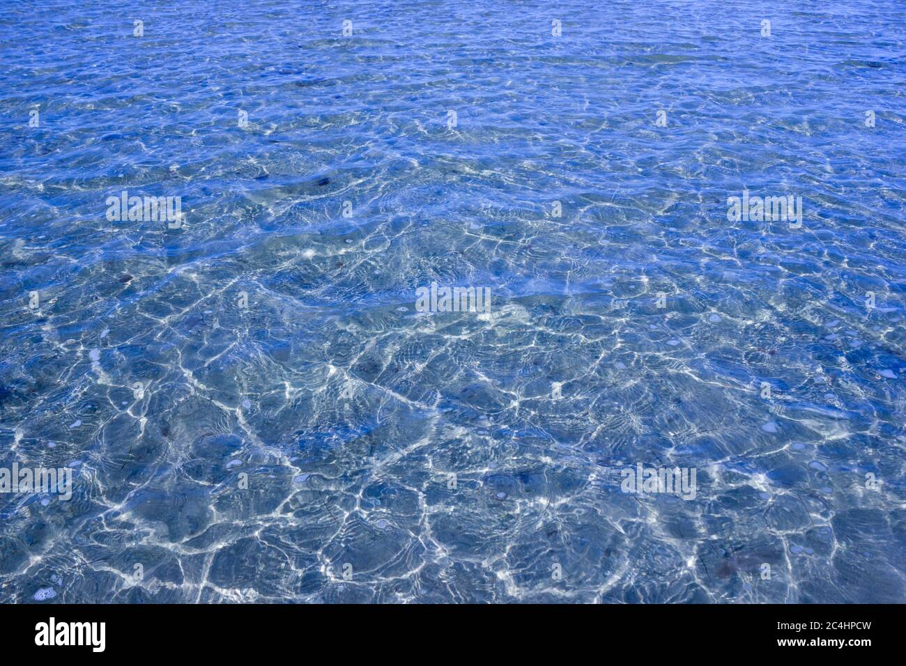 Texture of transparent sea waves in sunlight - top view Stock Photo - Alamy