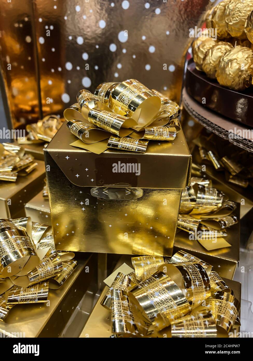 beautiful golden festive boxes with gifts Stock Photo - Alamy